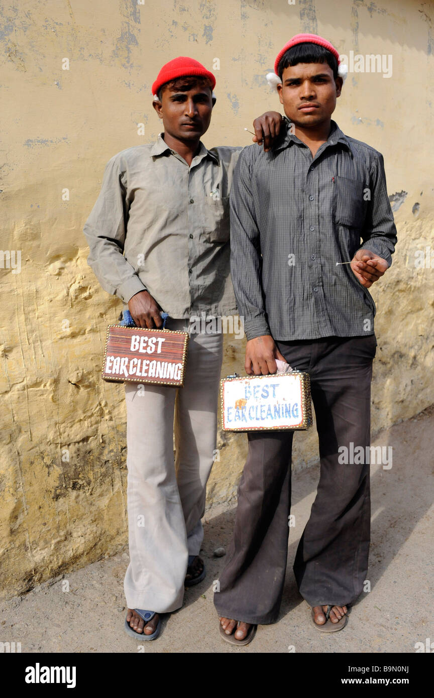 Ear cleaners with cotton wool behind their ears in Rishikesh Stock ...