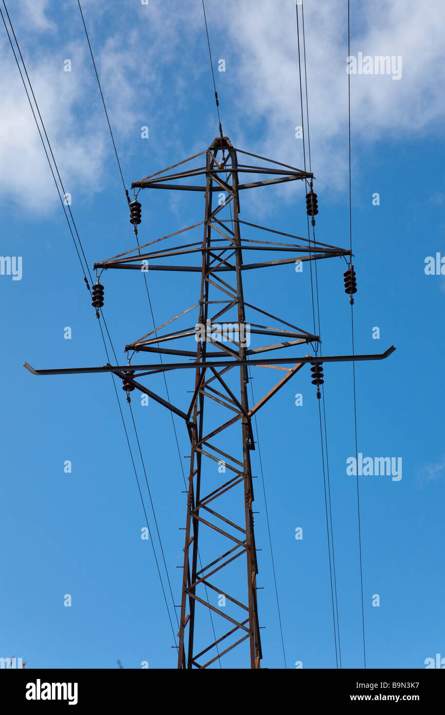 Single pylon against blue sky Stock Photo - Alamy