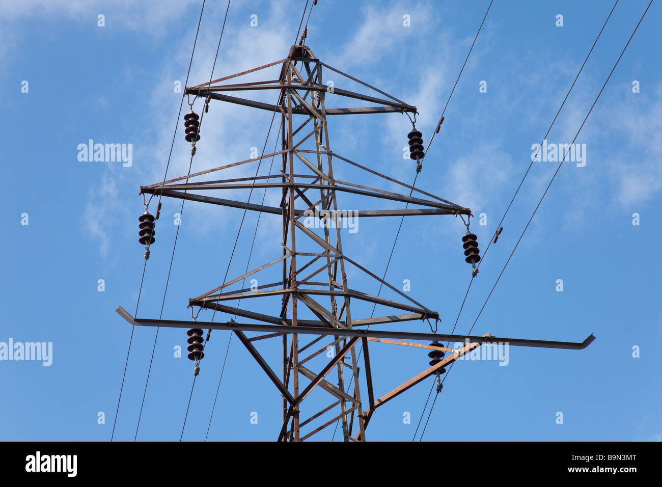 Single pylon against blue sky Stock Photo - Alamy