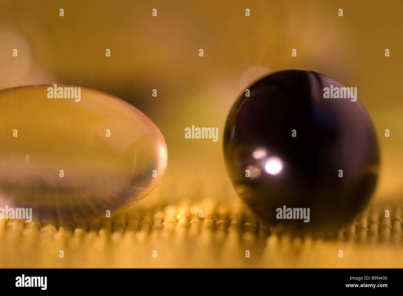 Garlic oil and multi vitimin capsules Stock Photo - Alamy