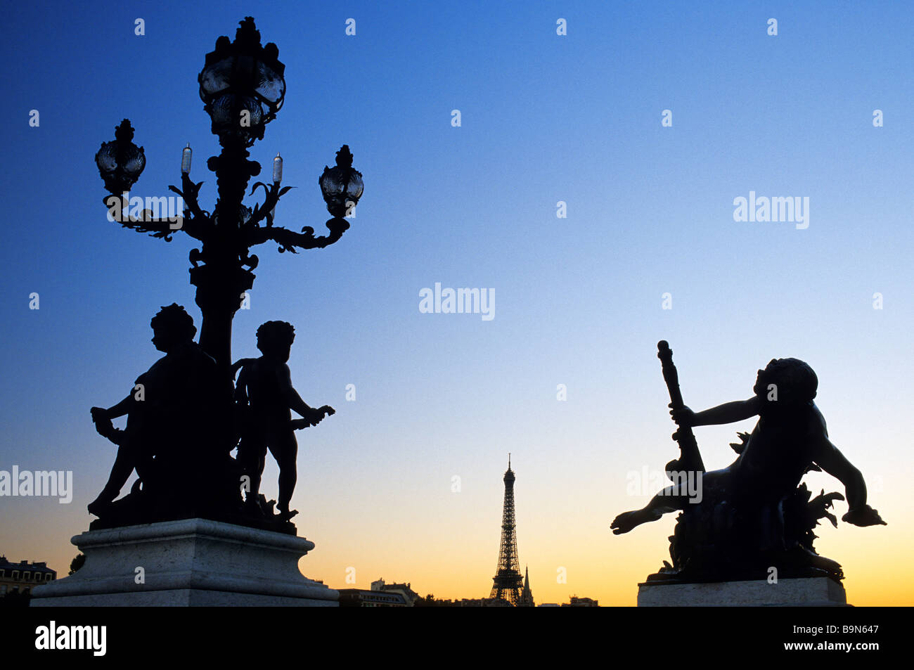 France, Paris, Pont Alexandre III, sunset on the lampposts and the ...