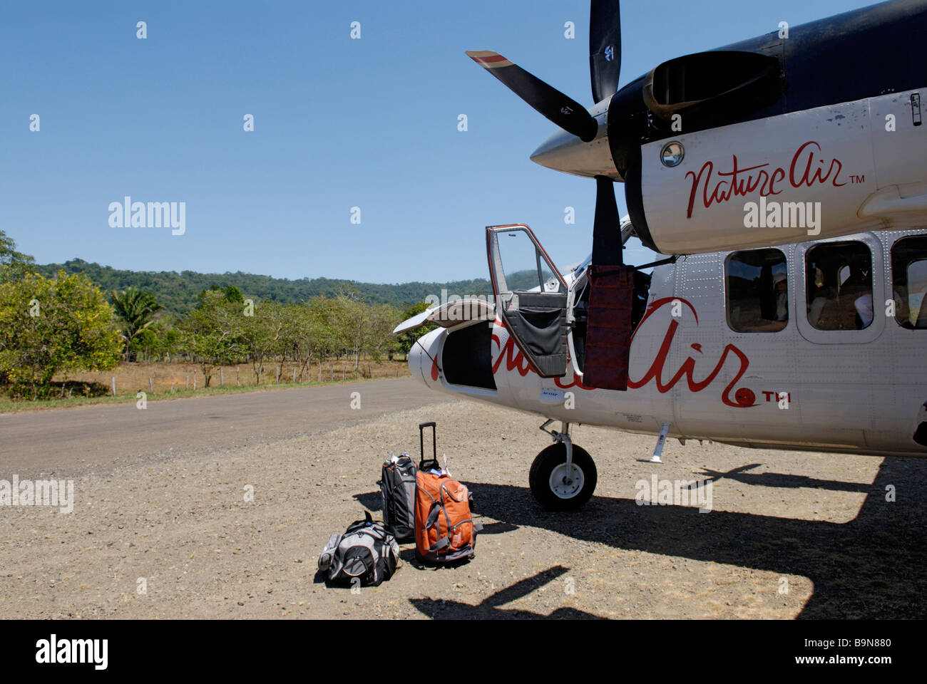 Small Nature Air propeller plane on runway, Drake Bay, Costa Rica Stock ...