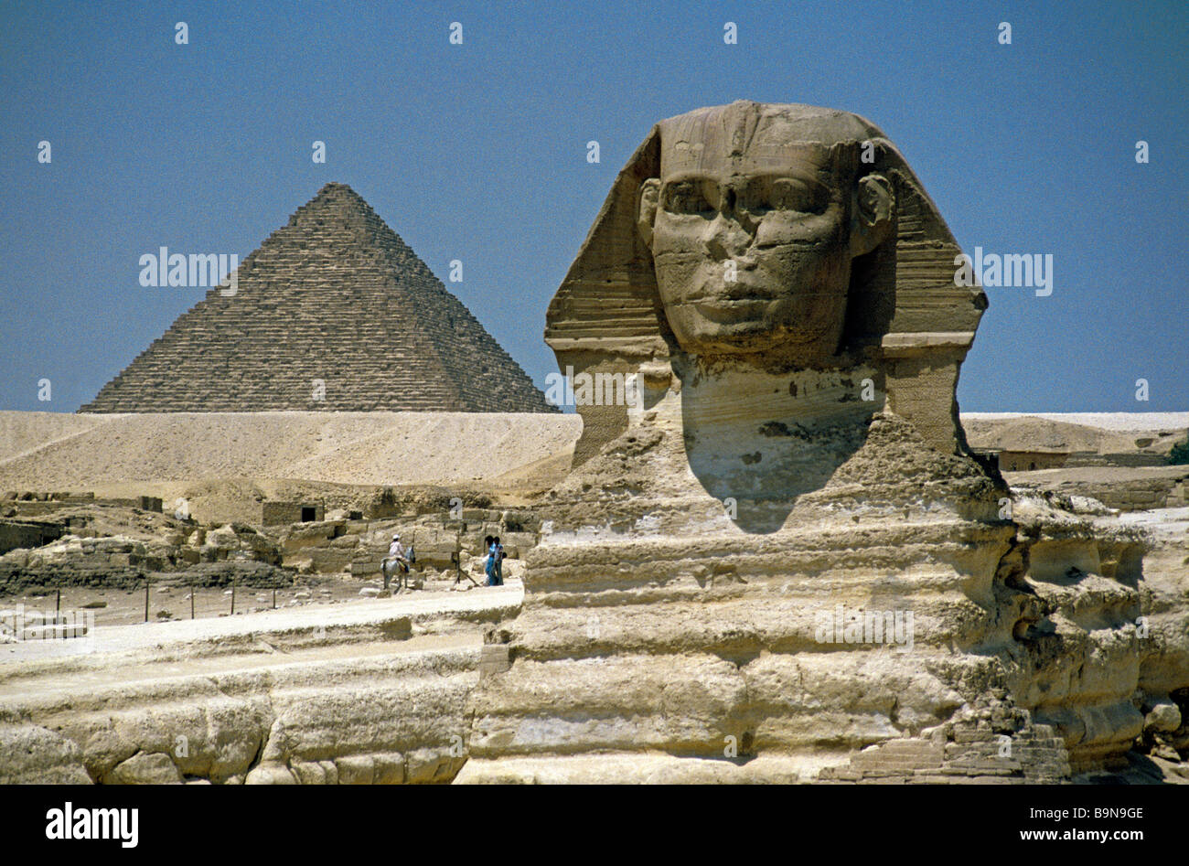 Front view of The Great Sphynx at Giza with Menkaure Pyramid behind ...