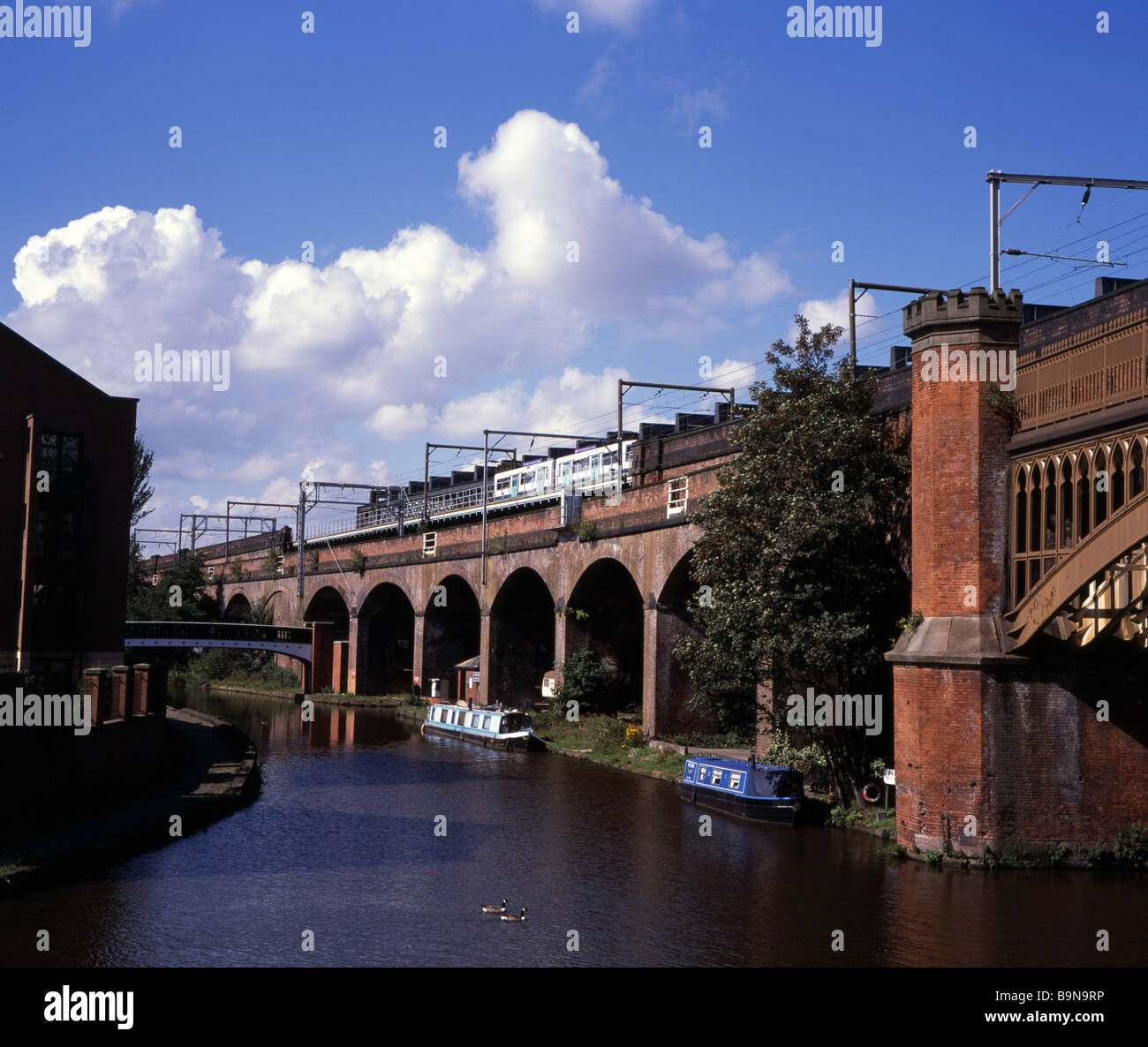 Castlefield Canal basin, the Bridgewater Canal, railway arches, and ...