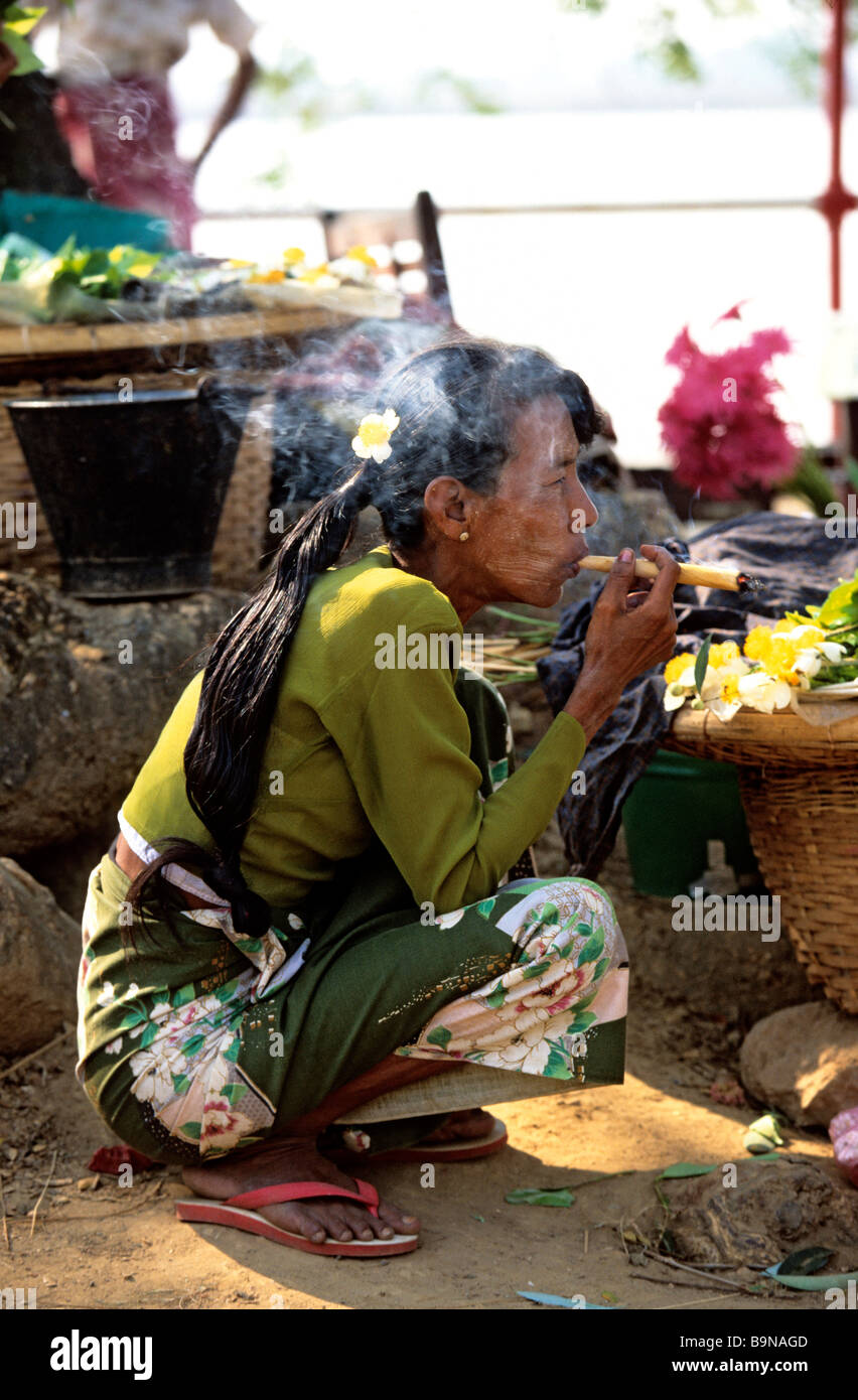 Myanmar (Burma), woman smoking a cheeroot, Burmese traditional cigar ...