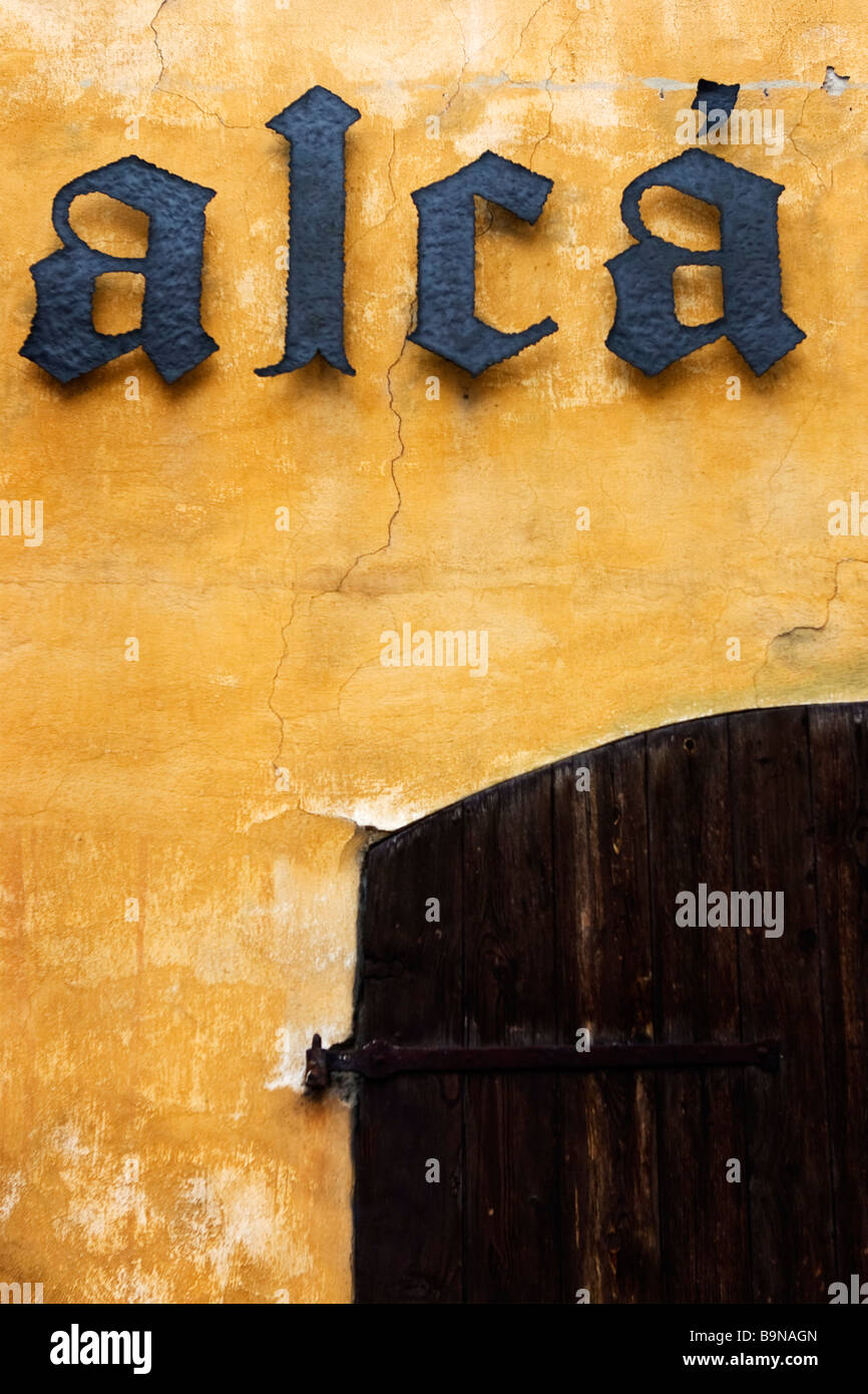 Yellow wall with gothic signs on it Stock Photo - Alamy