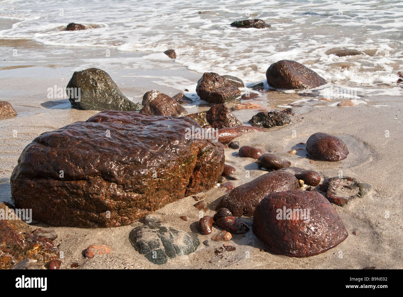 Rocks on the beach Stock Photo - Alamy