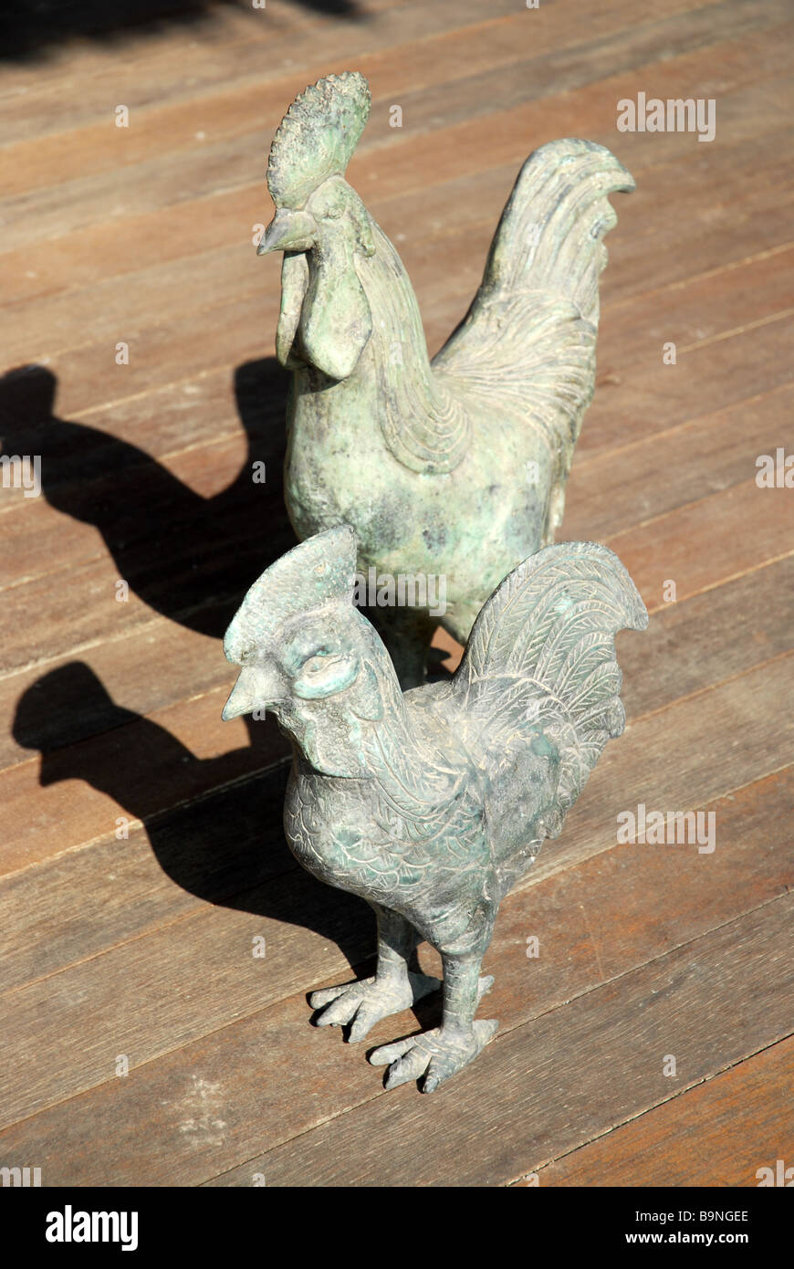 bronze chicken and cockerel ornaments from Indonesia Stock Photo - Alamy