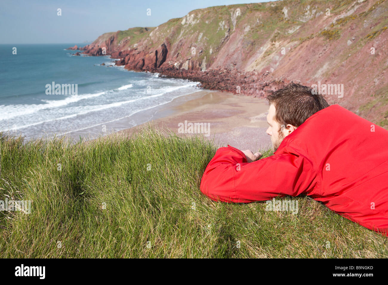 Lying on coastal rocks hi-res stock photography and images - Alamy