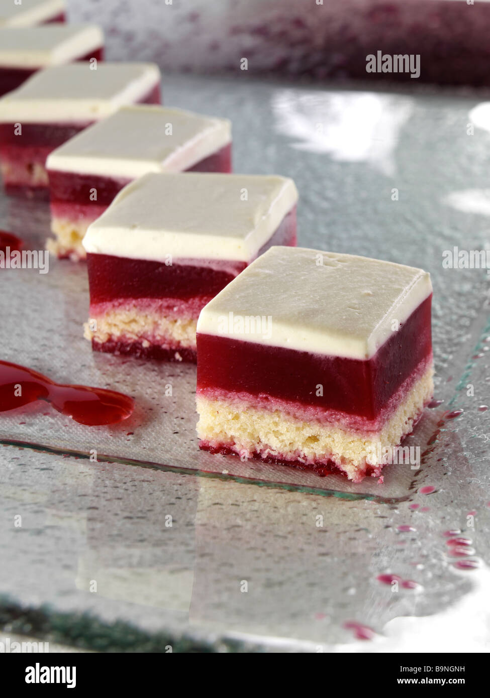 Compact Raspberry trifles sweet canapes Stock Photo - Alamy