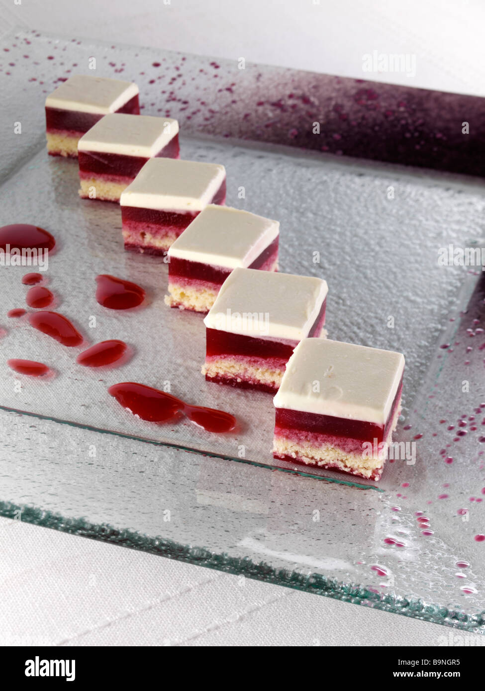 Compact Raspberry trifles sweet canapes Stock Photo - Alamy