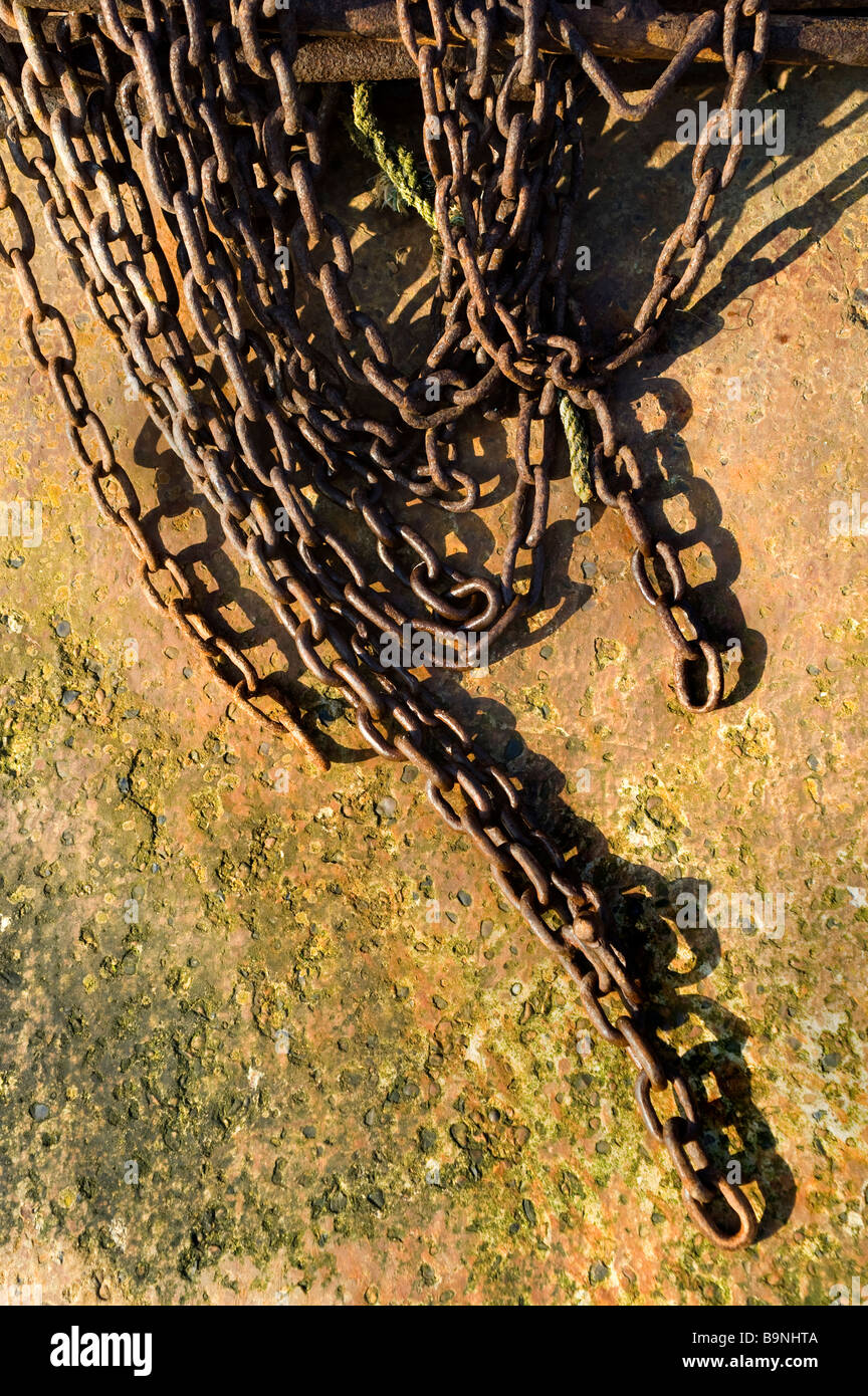 rusty chains on a harbour wall Stock Photo - Alamy