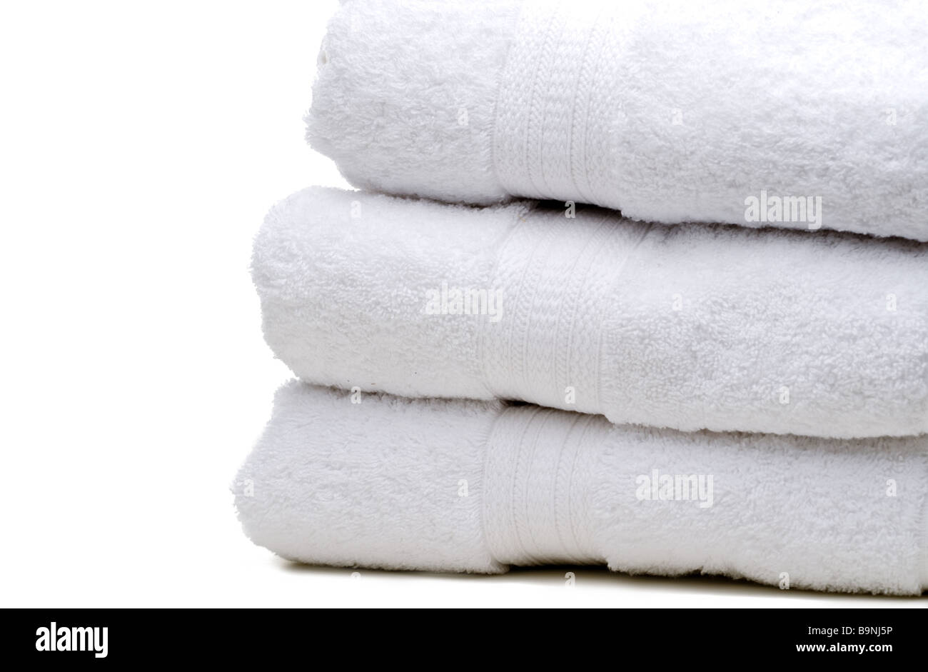 A stack of white towels on white Stock Photo - Alamy