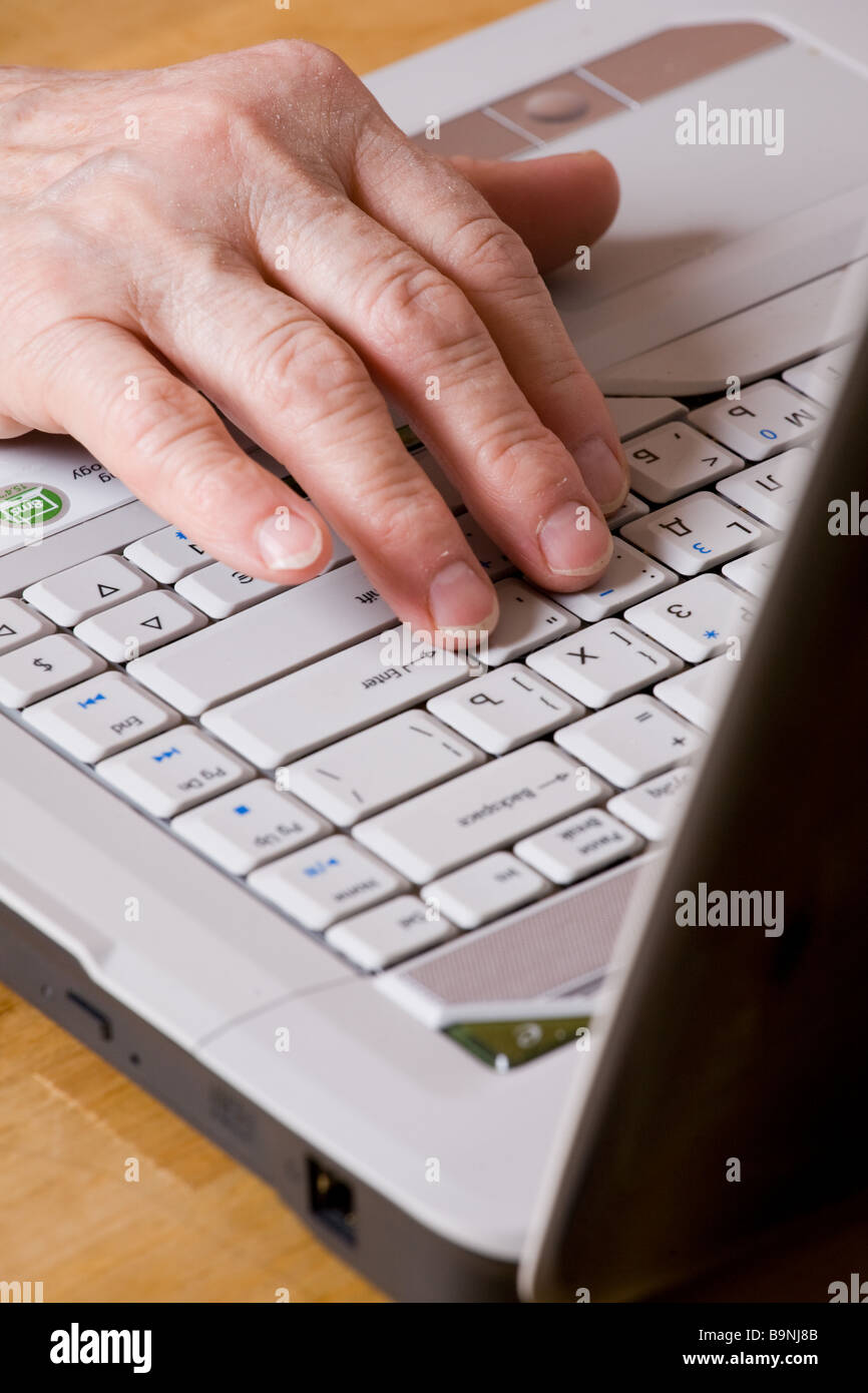 retired person's old hands over laptop keyboard typing Stock Photo - Alamy
