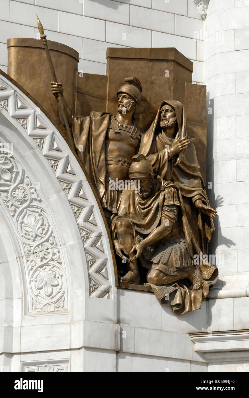Bronze figures of Bible characters above an entrance in the cathedral ...