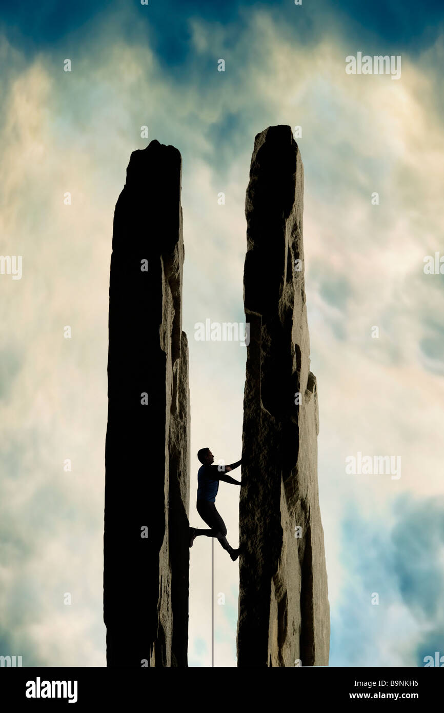 Silhouette of mountaineer climbing rock chimney, side view Stock Photo ...