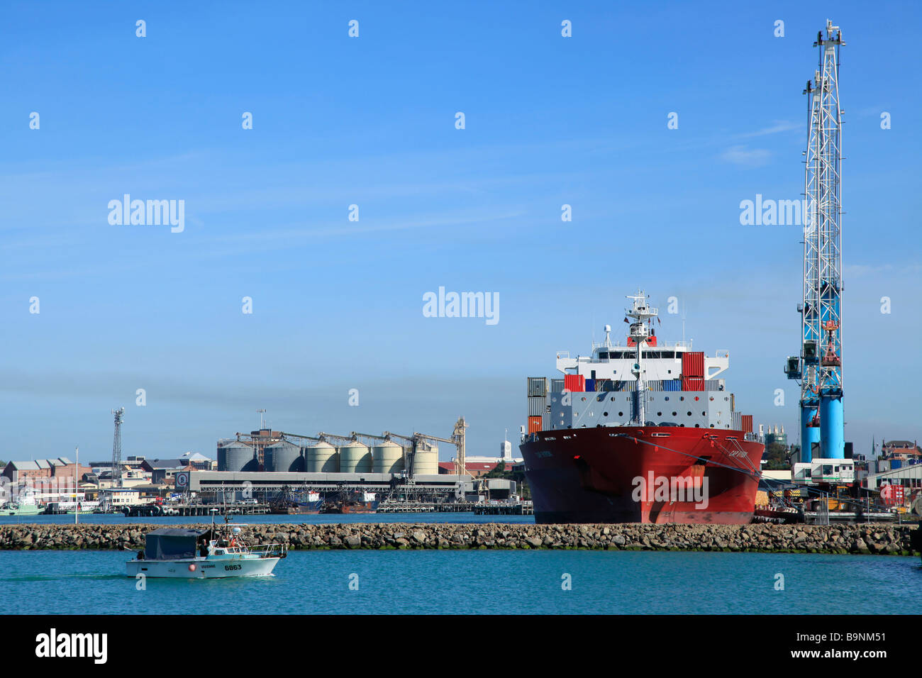 Cranes loading container cargo ship in Prime Port,Timaru,Canterbury ...