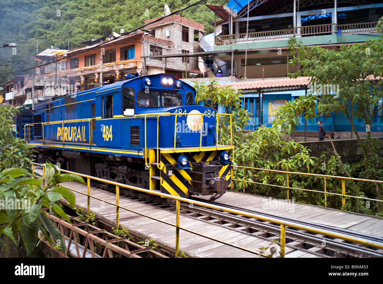 PERU AGUAS CALIENTES Local Perurail train leaving the station in Aguas ...