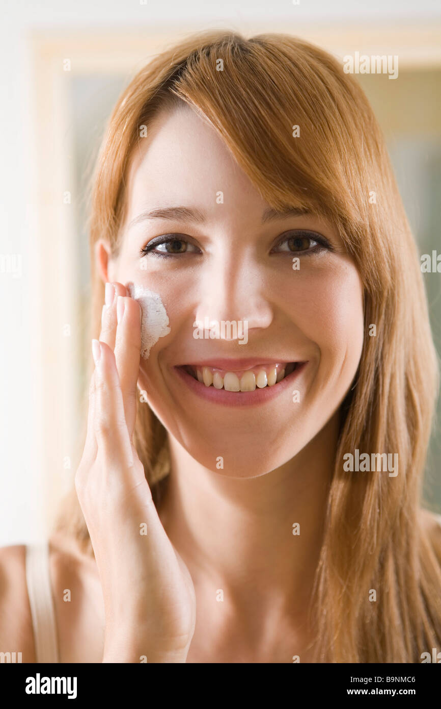 Woman creaming face hi-res stock photography and images - Alamy