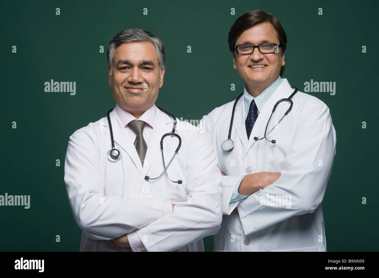 Portrait of two doctors smiling Stock Photo - Alamy