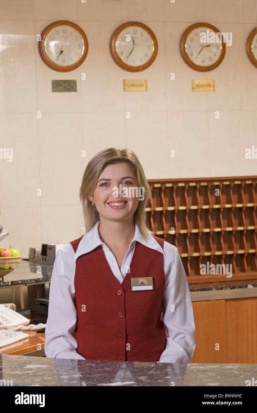 portrait of smiling young receptionist at hotel Stock Photo - Alamy