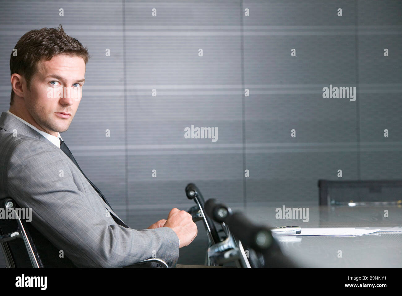 businessman sitting at conference table in meeting room Stock Photo - Alamy