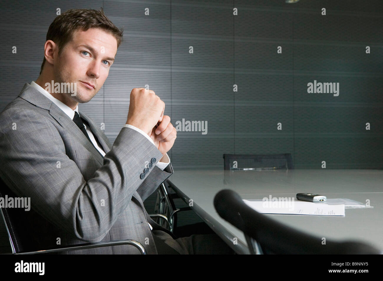 businessman sitting at conference table in meeting room Stock Photo - Alamy