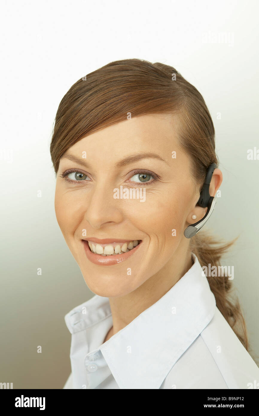 headshot of businesswoman wearing headset for mobile phone Stock Photo ...