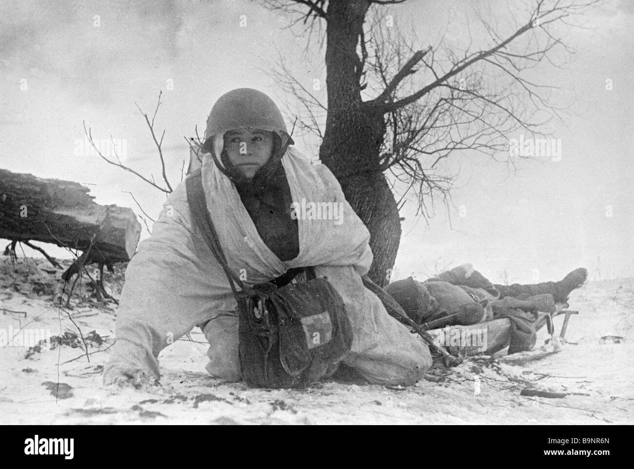 A nurse sledging a wounded soldier away from the battlefield The ...