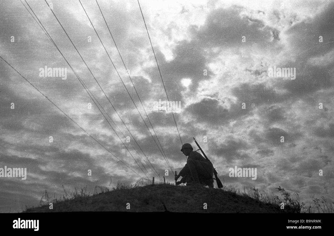 A communications man pulling a wire The Stalingrad Front Stock Photo ...