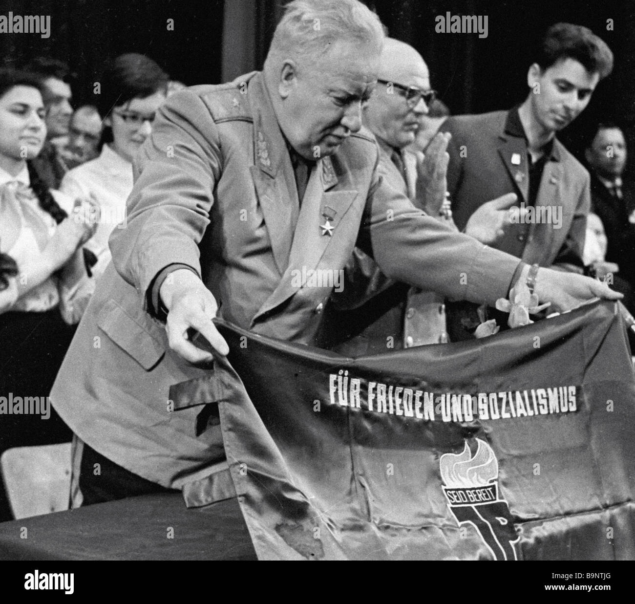 Major General Alexander Saburov receiving the banner of the German ...