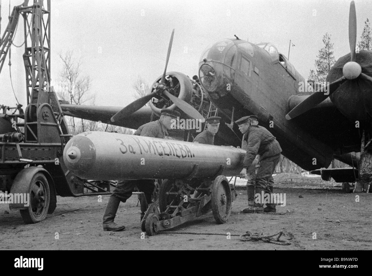 Soldiers loading a torpedo on a plane The Northern Fleet Stock Photo ...