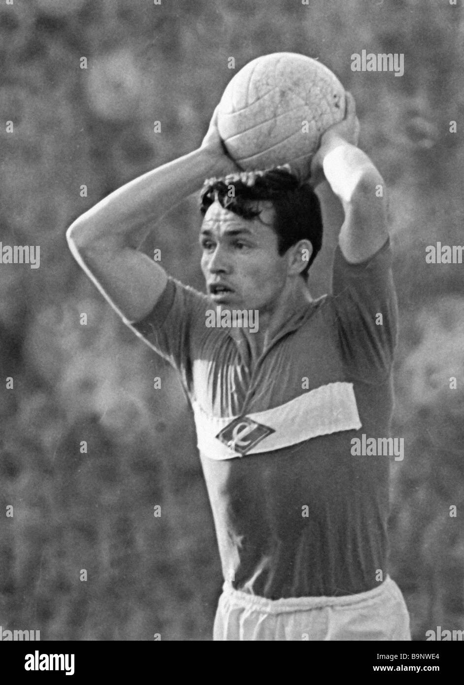 Soviet national football team player Galimzyan Khusainov holds a ball ...