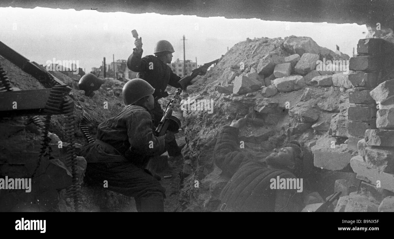 A soldier throwing a grenade from a trench Stock Photo - Alamy