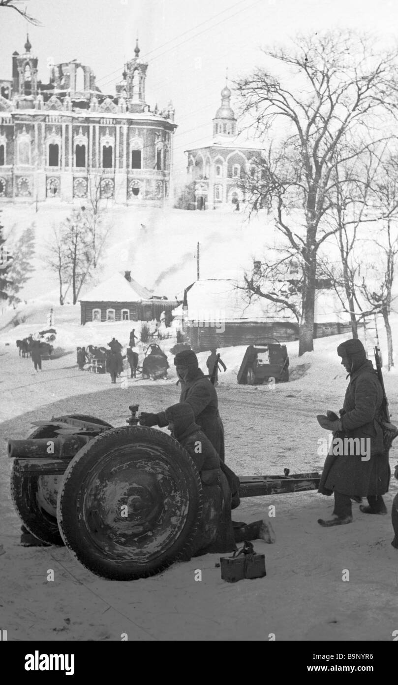 Red Army men pulling a gun A dome of an Orthodox church in the ...