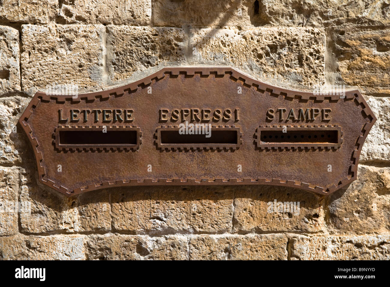 Decorative cast iron letter boxes in San Gimignano, Tuscany, Italy ...