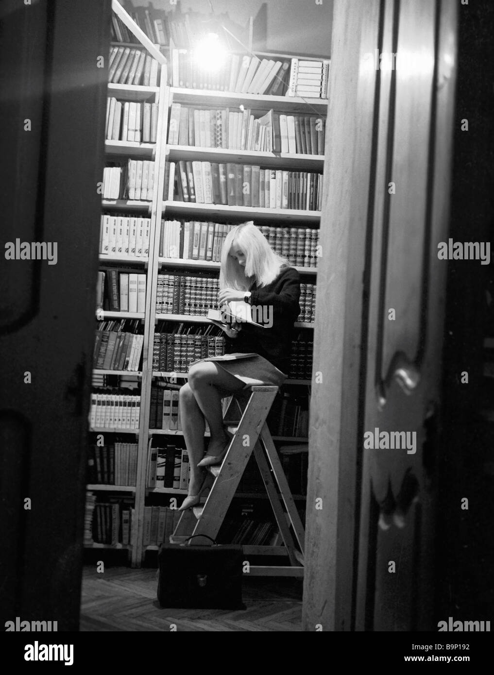 Girl On Library Ladder High Resolution Stock Photography and Images - Alamy