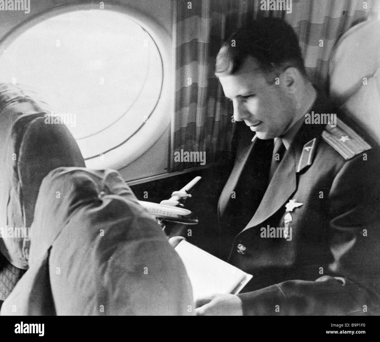 Cosmonaut Yury Gagarin keeps working on his way to Moscow after the ...