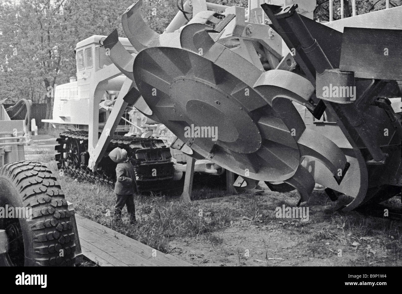 A child gazing at an ETR 122 dual rotor excavator Stock Photo - Alamy