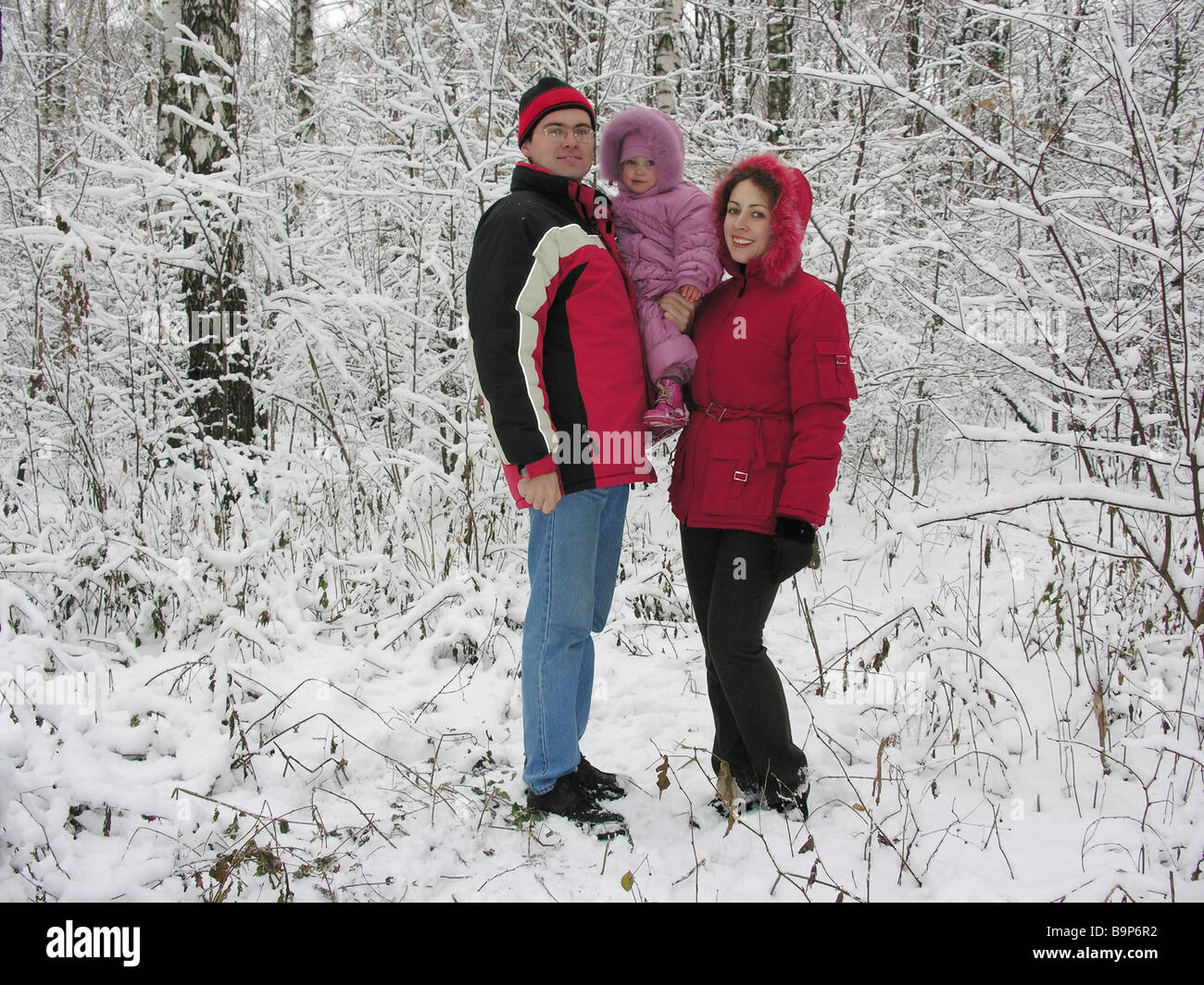 family and first snow Stock Photo - Alamy