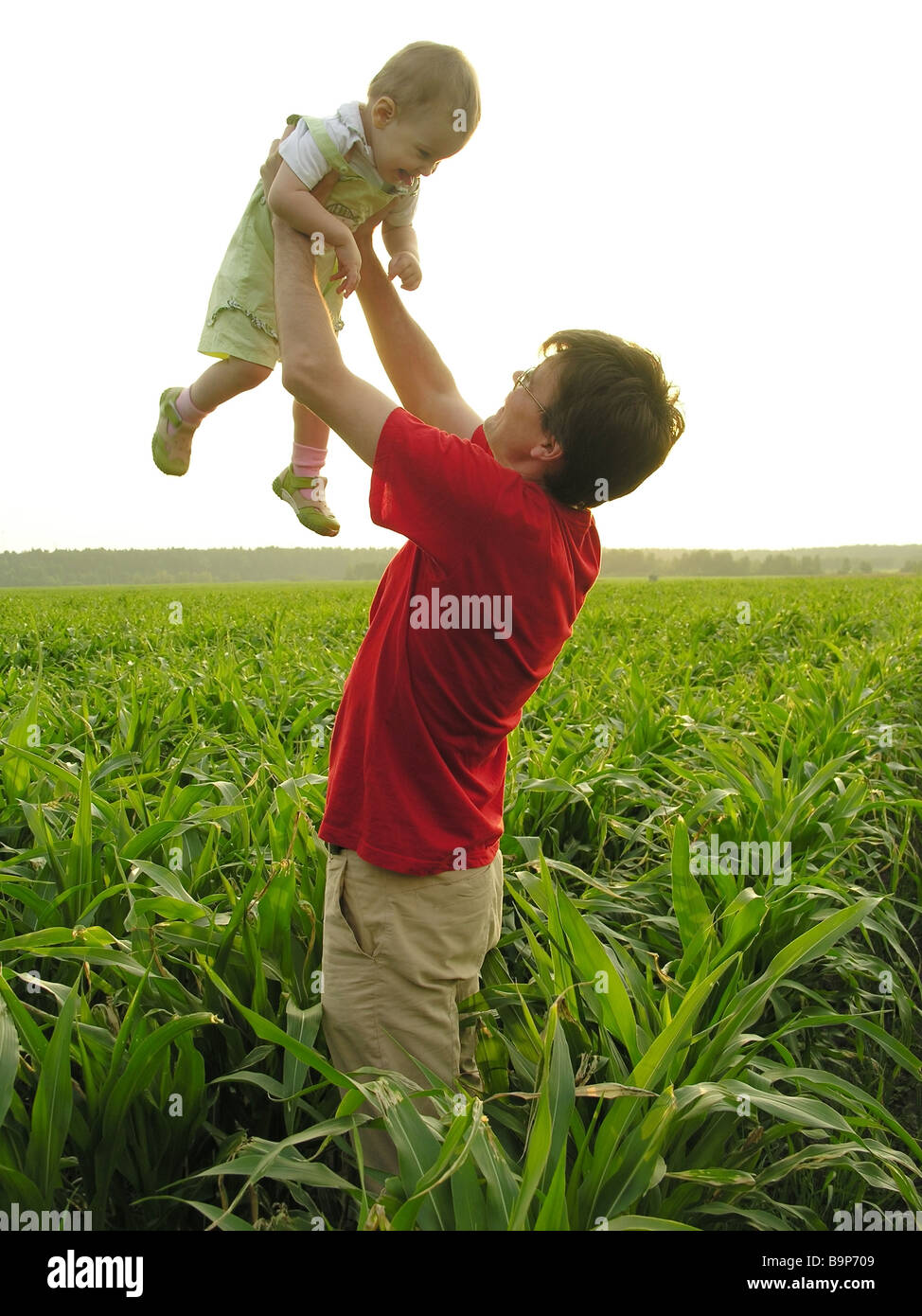 father with baby in field Stock Photo - Alamy