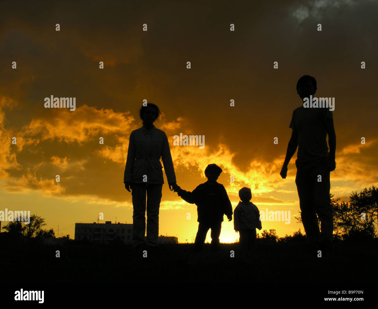 family of four sunset 3 Stock Photo - Alamy