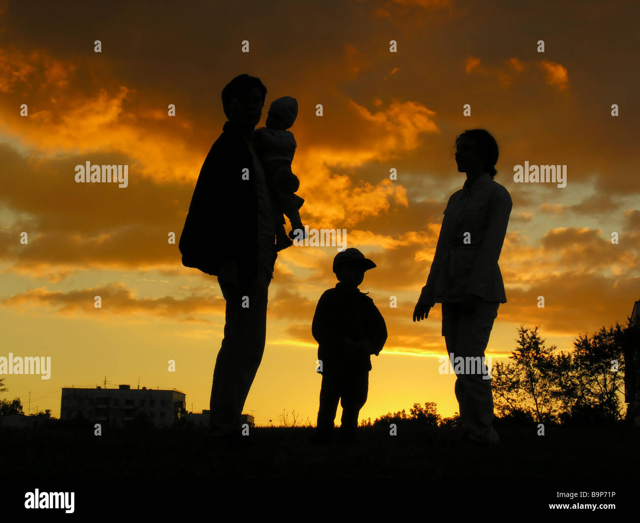 family of four sunset Stock Photo - Alamy