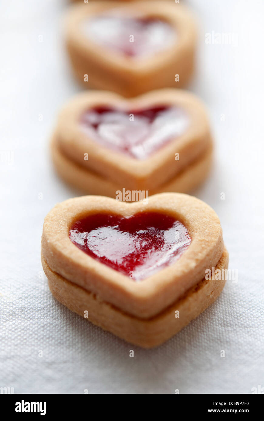 Row of heart shaped jam tarts Stock Photo - Alamy