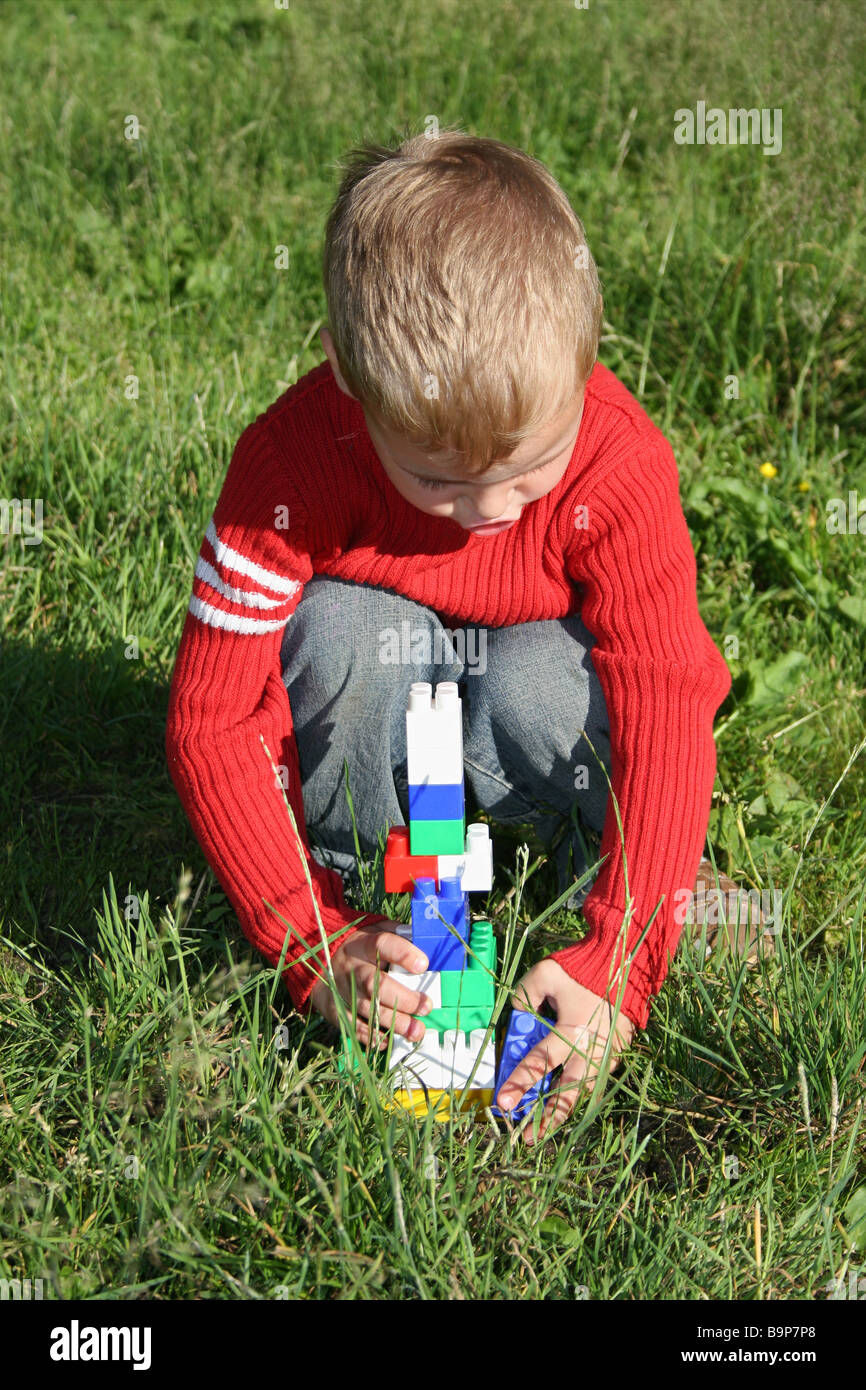 child play in grass Stock Photo - Alamy