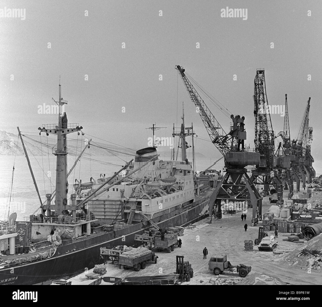Discharging oceanic liner in Magadan port Stock Photo - Alamy