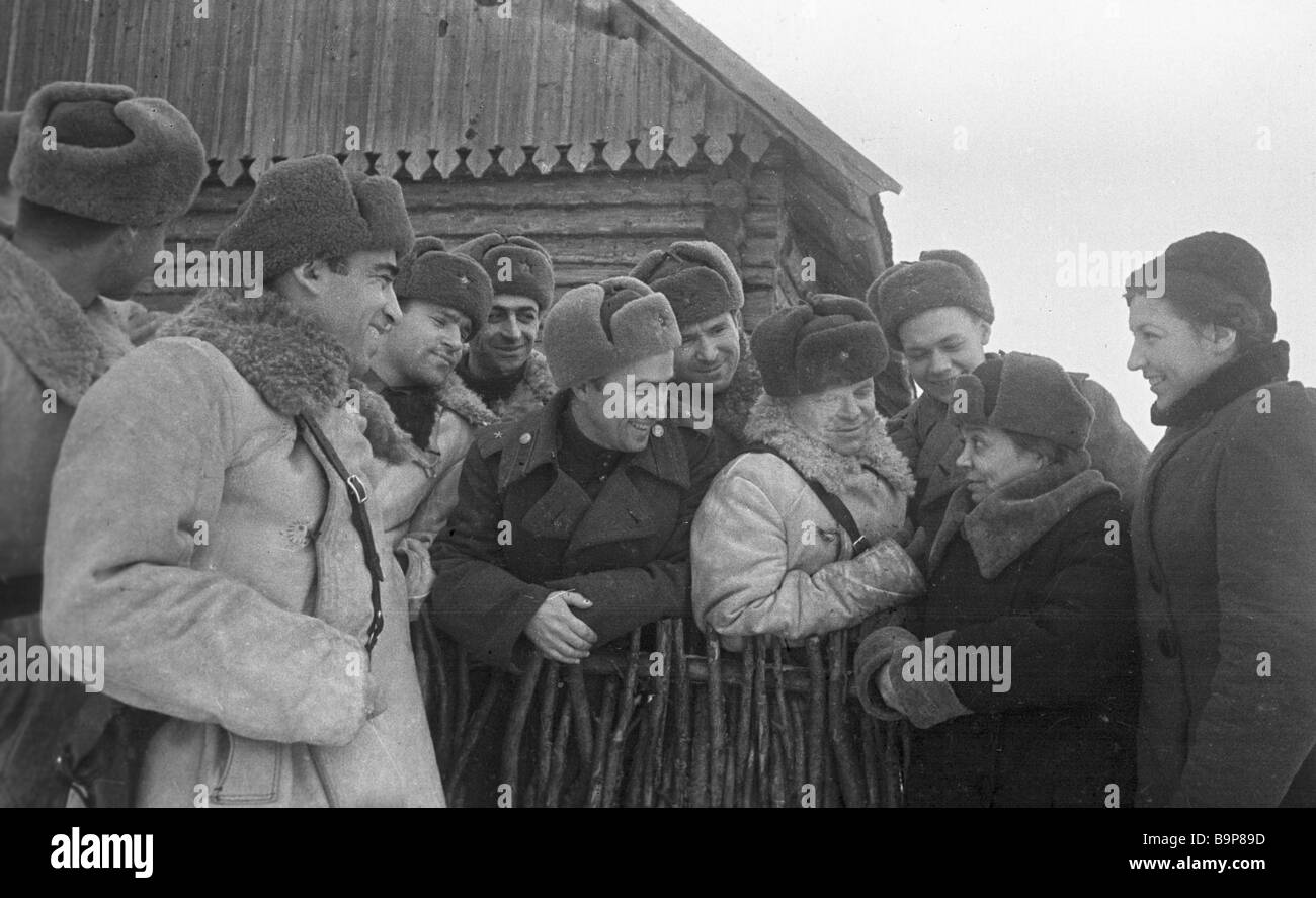 Red Army men talking to villagers Stock Photo - Alamy