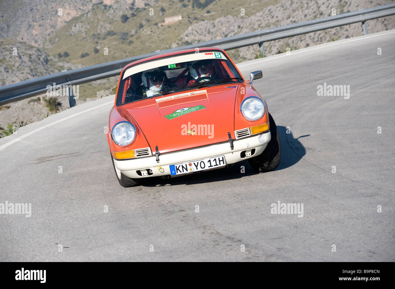 Red 1972 Porsche 911T sports car racing in the Classic car rally ...