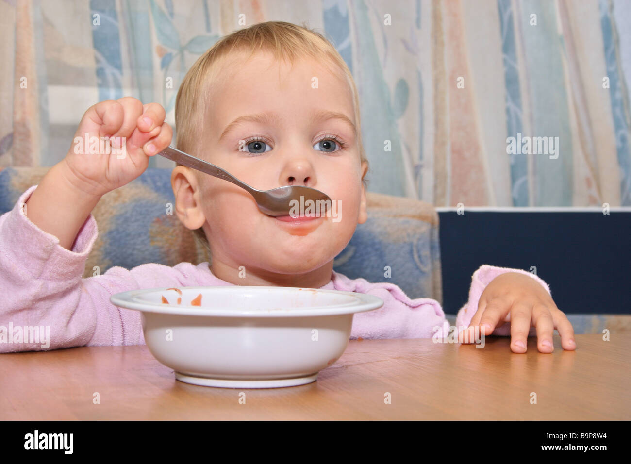 baby eat with spoon Stock Photo - Alamy