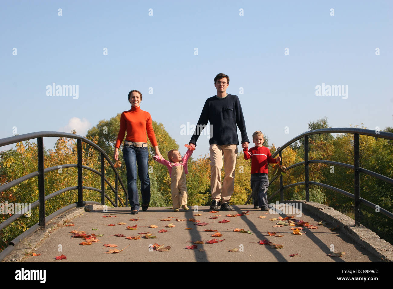 family of four on bridge Stock Photo - Alamy